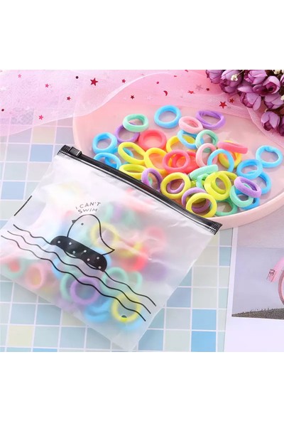 Mingy Şeffaf Çantalı Çok Renkli 100'LÜ Lastik Çocuk Tokası Mingy Şeffaf Çantalı Çok Renkli 100'LÜ Lastik Çocuk Tokası