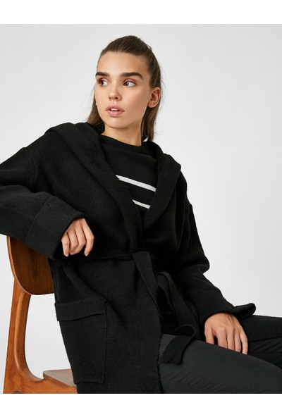 Koton Beli Kusakli Kapüsonlu Duble Kol Ucu Triko Yelek Koton Beli Kusakli Kapüsonlu Duble Kol Ucu Triko Yelek