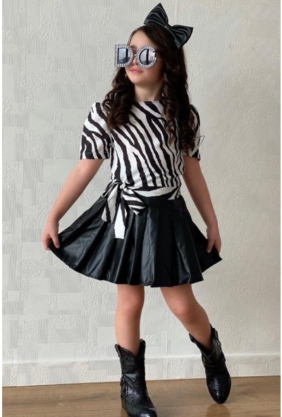 Kız Çocuk Zebra Desenli Şifon Bluzlu ve Taçlı Siyah Deri Etekli Takım