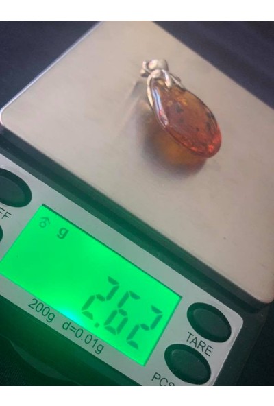 Doğal Kaya Damla Kehribar Kolye Ucu Gümüş Aparatlı 2,62 Gram Doğal Kaya Damla Kehribar Kolye Ucu Gümüş Aparatlı 2,62 Gram