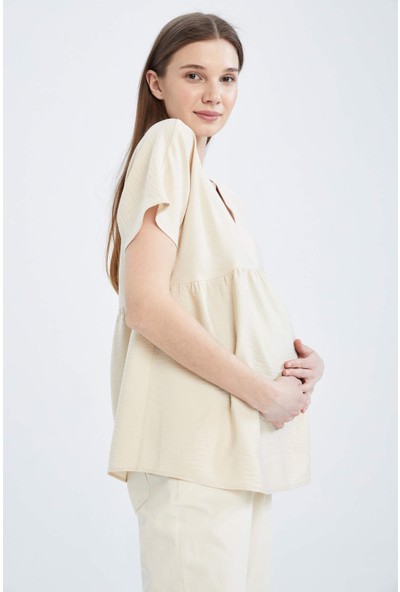 DeFacto Regular Fit Dokuma Volanlı Kisa Kollu Hamile Bluz X7296AZ22SM DeFacto Regular Fit Dokuma Volanlı Kisa Kollu Hamile Bluz X7296AZ22SM
