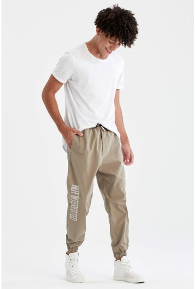 DeFacto Beli Bağcıklı Paraşüt Kumaş Jogger Pantolon V6381Az21Hs DeFacto Beli Bağcıklı Paraşüt Kumaş Jogger Pantolon V6381Az21Hs