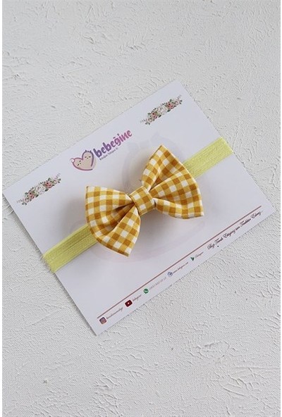 Bebeğine Sarı Renkli Pötikareli Fiyonk Bant