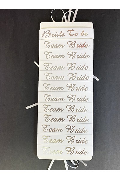 Turuncix Bride To Be Bileklik - Team Bride Bileklik - Beyaz Üzeri Metalize Gümüş Yazılı 12 Adet Turuncix Bride To Be Bileklik - Team Bride Bileklik - Beyaz Üzeri Metalize Gümüş Yazılı 12 Adet
