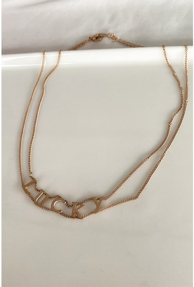 Nar Gifts Lucky Yazılı Çelik Kolye ( Altın Renk ) Nar Gifts Lucky Yazılı Çelik Kolye ( Altın Renk )